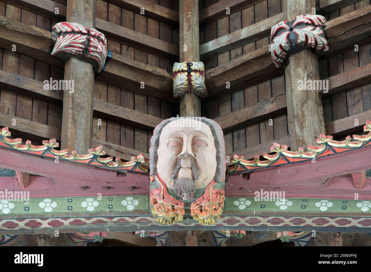 A representation of Cardinal Morton's face carved into a ceiling boss ...