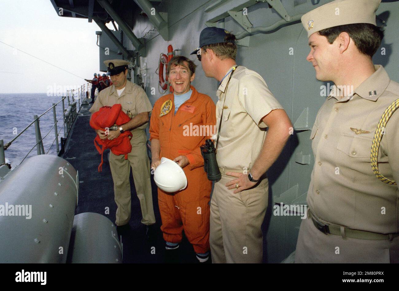 Secretary of the Navy John F. Lehman Jr. talks with the commanding ...