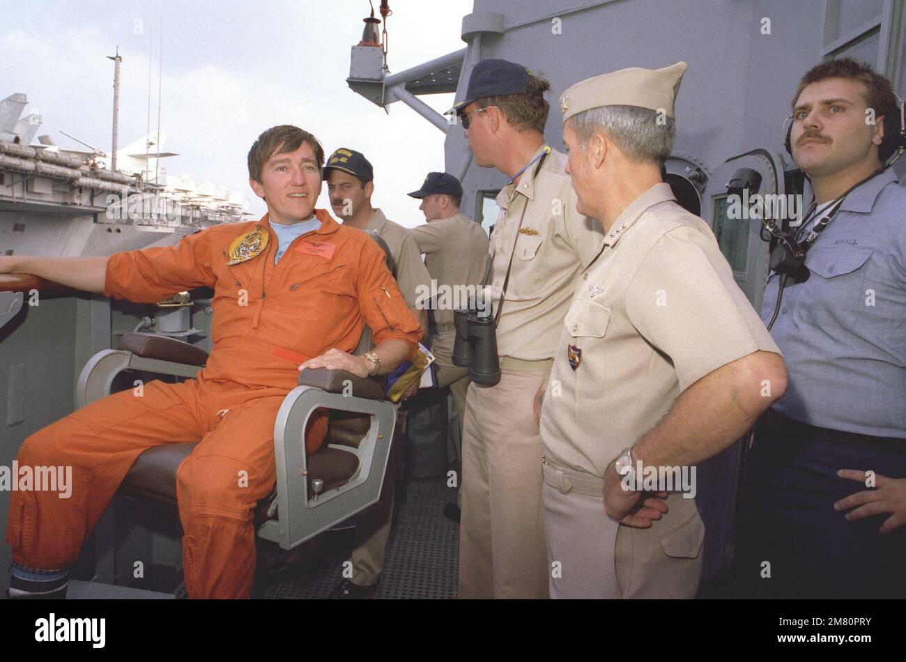 Secretary of the Navy John F. Lehman Jr. talks with Vice Admiral Edward ...