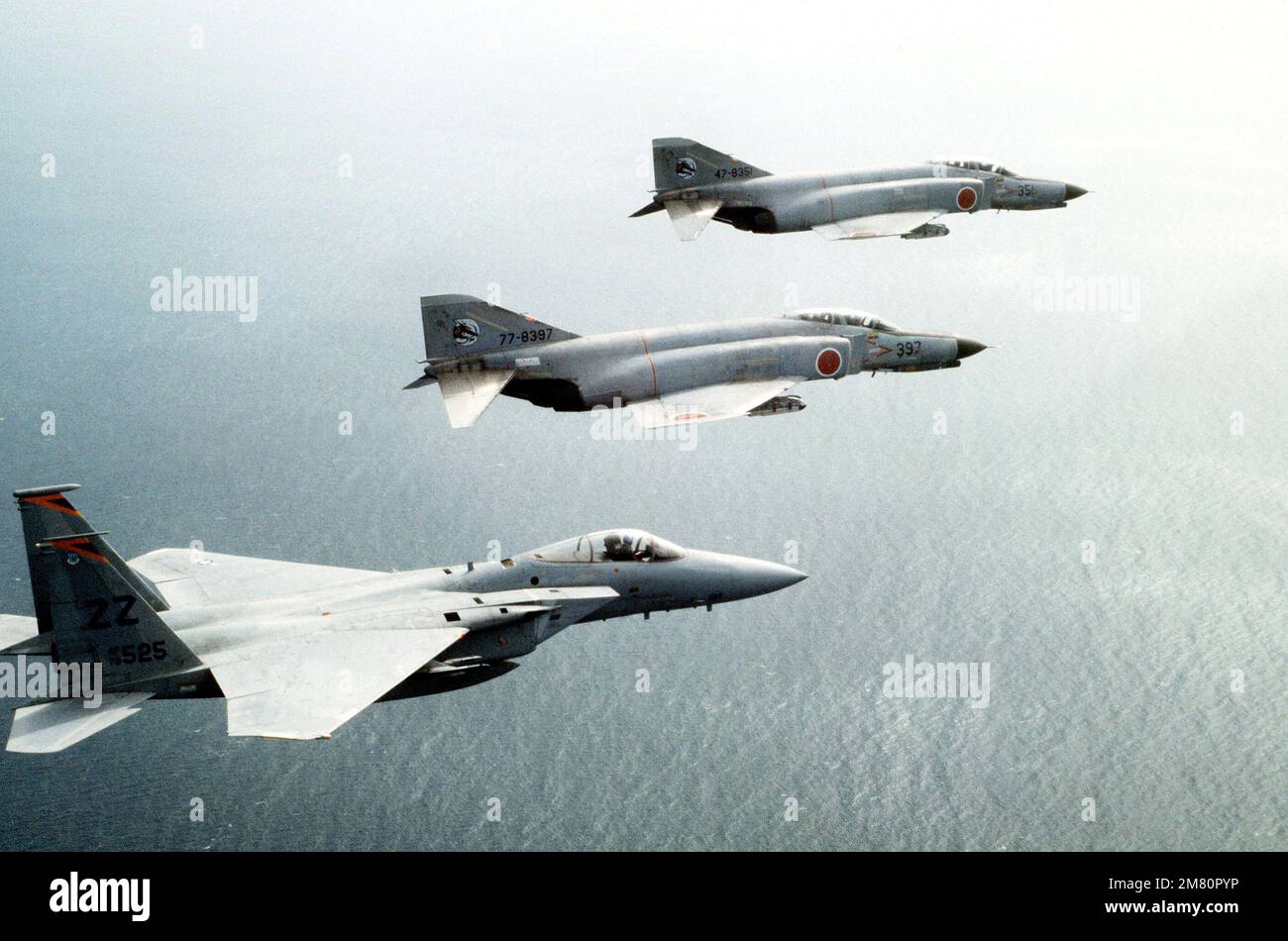 An air-to-air right side view of two Japanese Air Self Defense Force ...