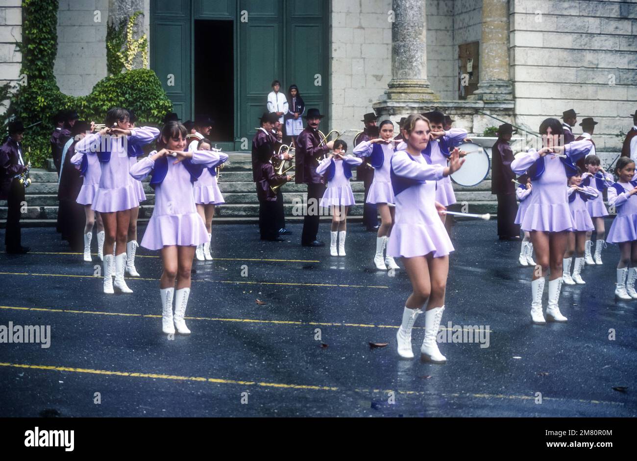 Majorettes performing in the rain at Saint-Clément-des-Levées, France ...