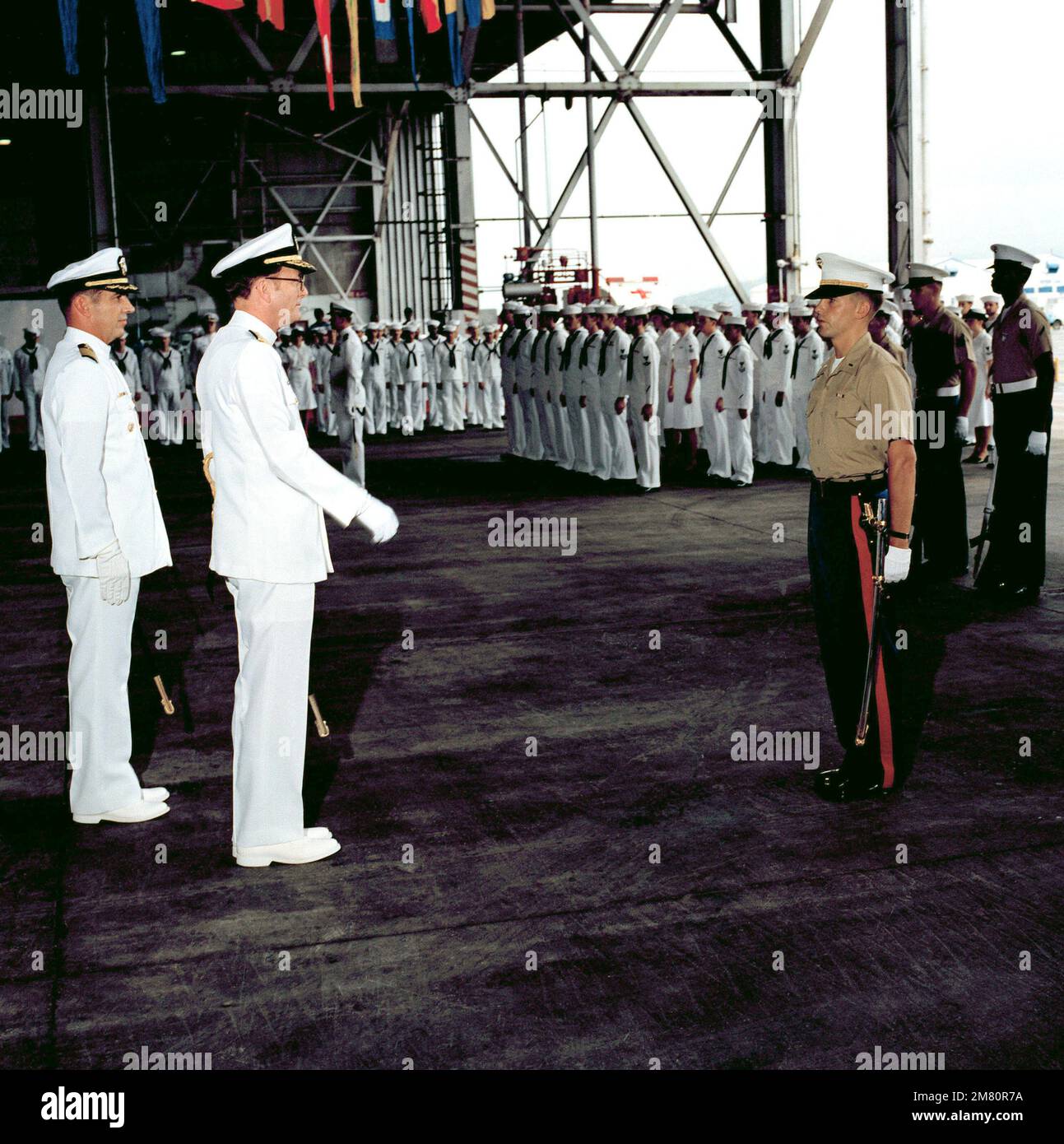 Vice Admiral James R. Hogg (c) Captain Paul D. Stevenson inspect a ...