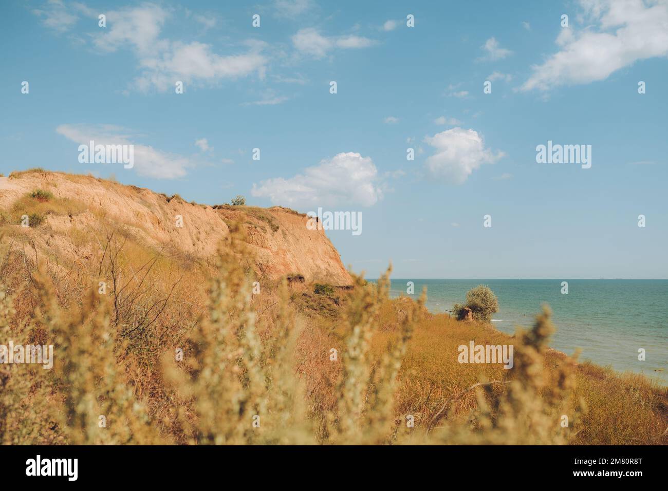 Amazing landscape with sea bay, sand beach and coastal hills and rocks ...