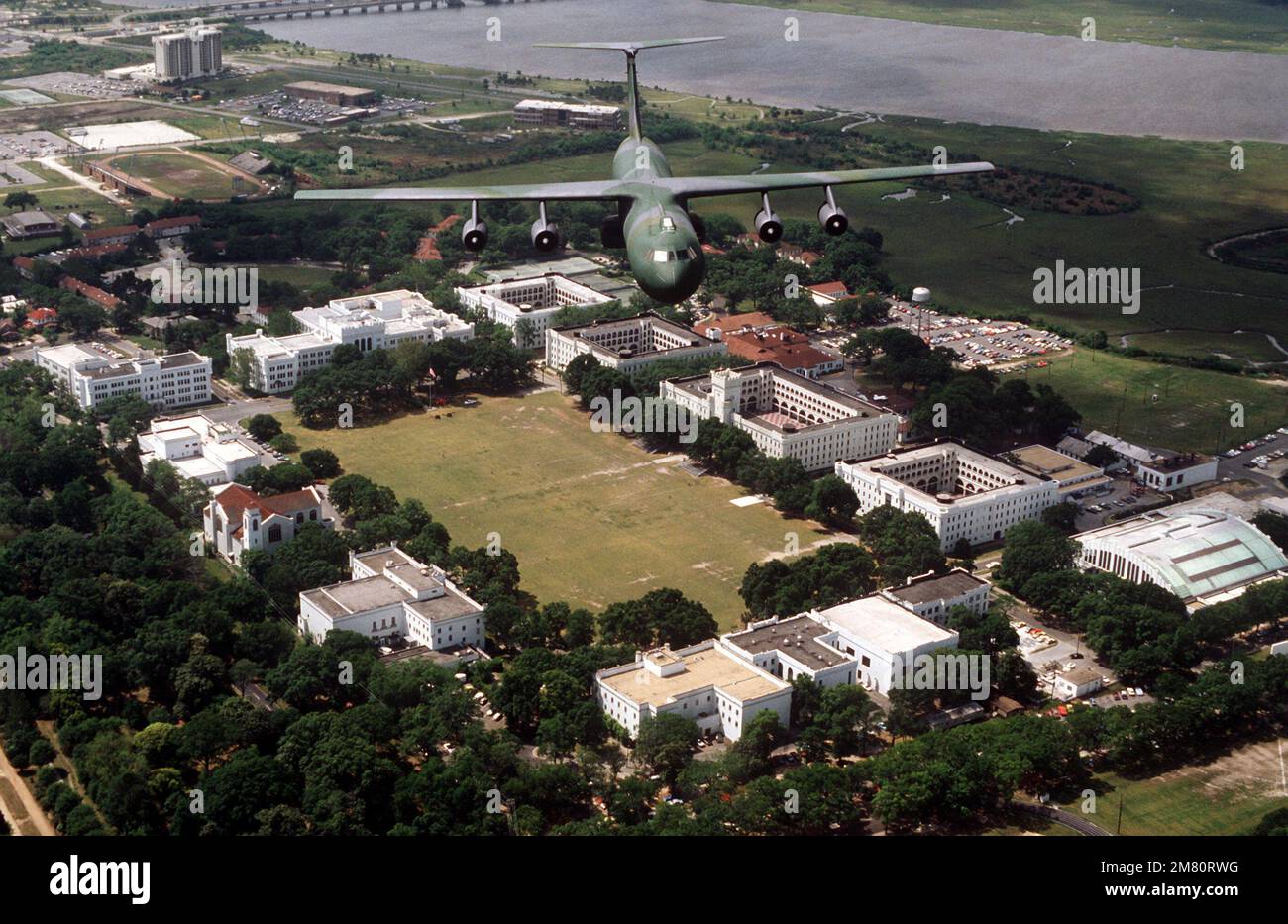 An air-to-air front view of a C-141B Starlifter aircraft in camouflage ...