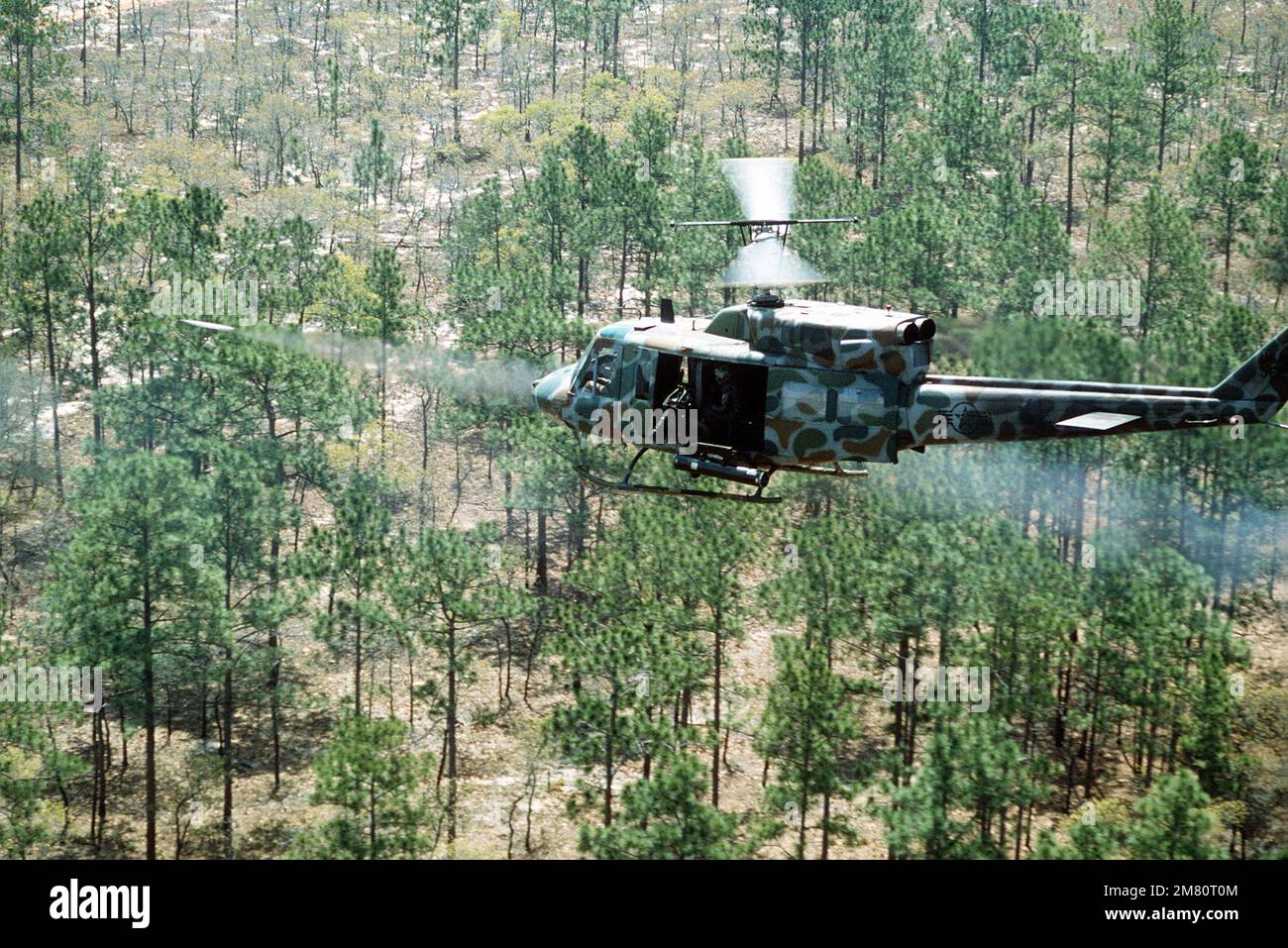 Air-to-Air left rear view of a UH-1N Iroquois helicopter with a ...