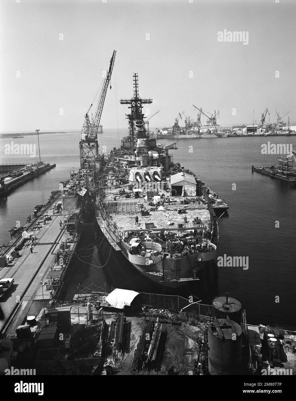 An elevated stern view of the battleship USS IOWA (BB 61) undergoing reactivation/modernization ...