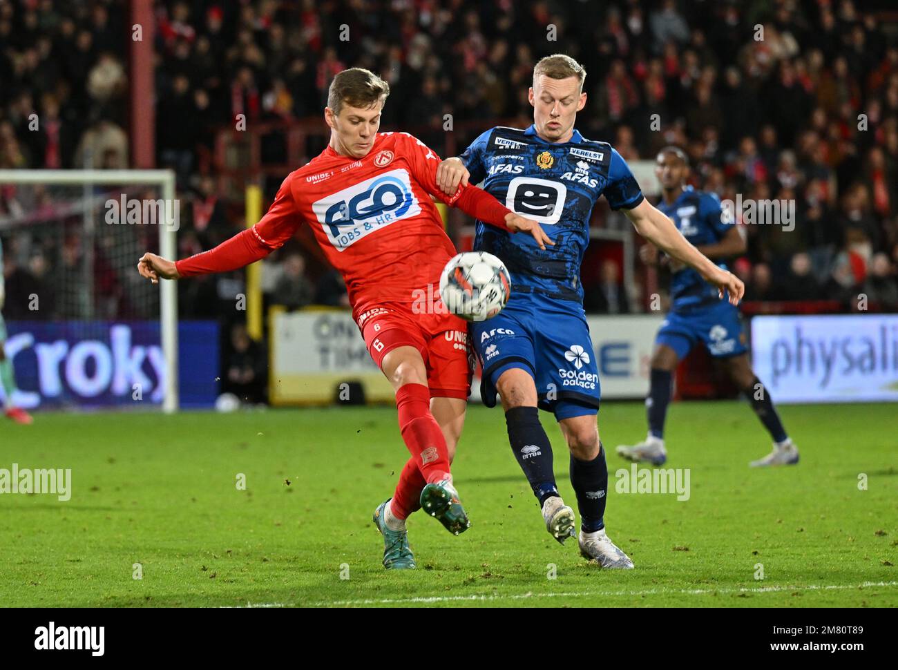 Oleksii Sych (6) of KV Kortrijk and Nikola Storm (11) of KV Mechelen pictured fighting for the ...