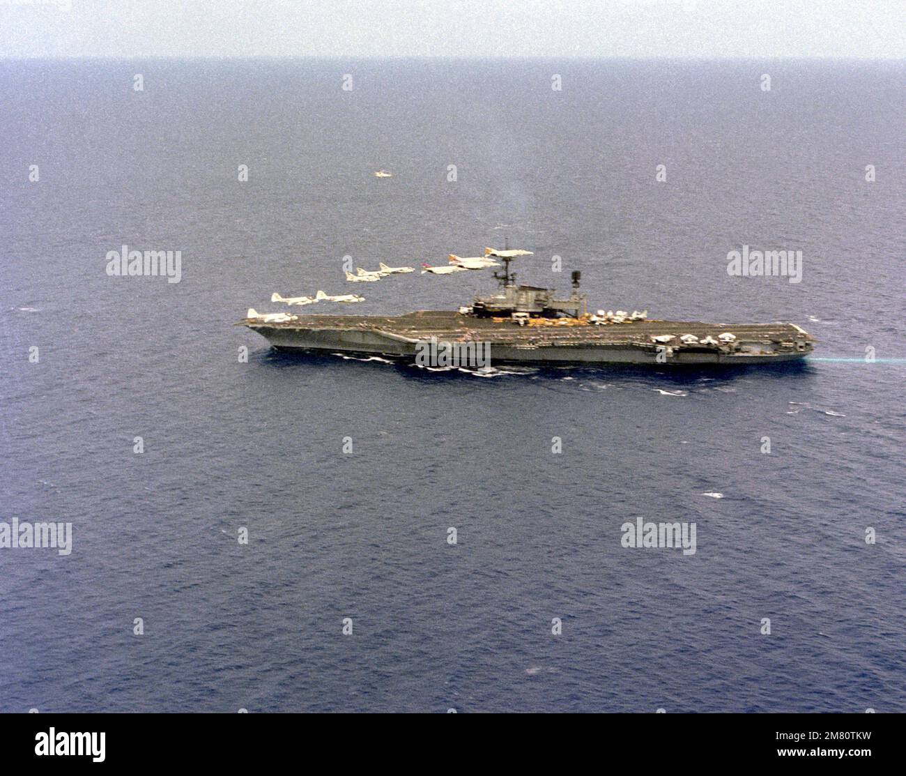 Aircraft of Carrier Air Wing 5 (CVW-5) fly over the aircraft carrier ...