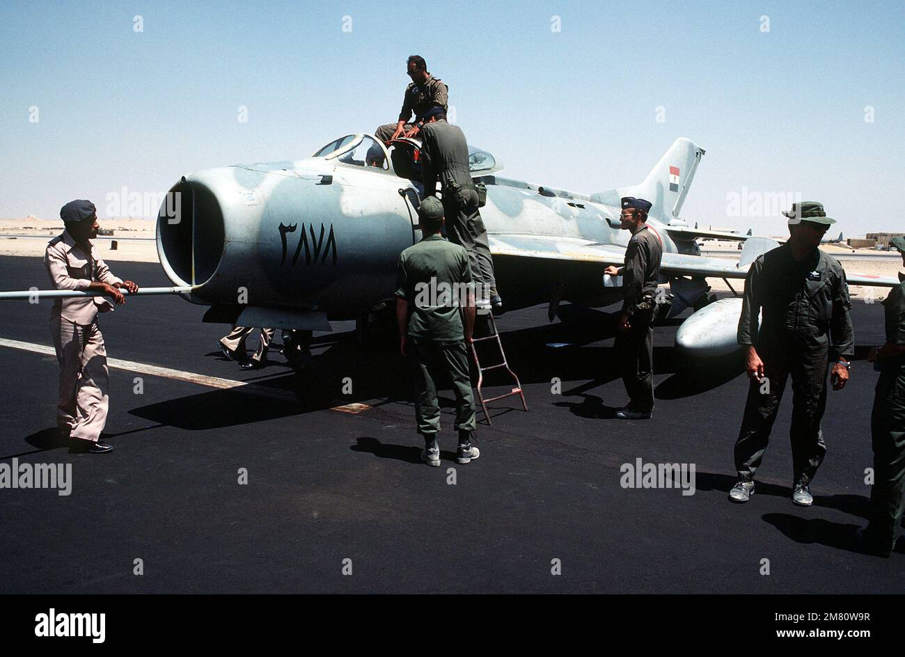 Air Force personnel inspect an Egyptian MiG-17 aircraft (Soviet ...