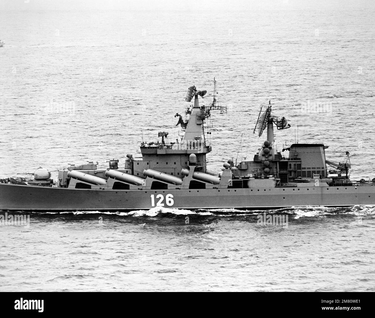 A port amidship view of the Soviet cruiser SLAVA, the first of its ...
