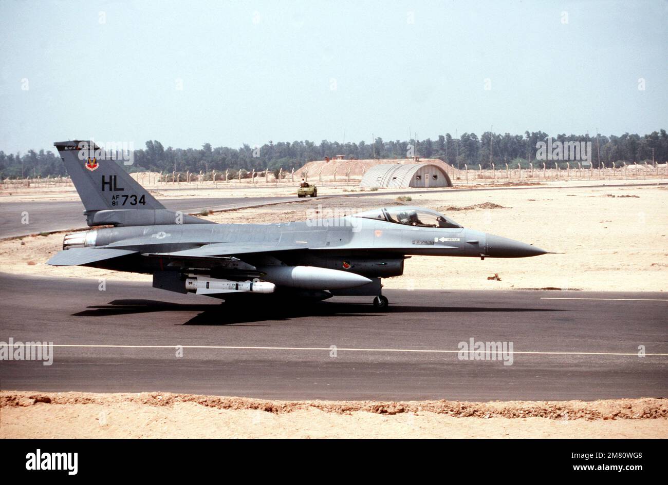 A right side view of an F-16 Fighting Falcon aircraft in use during ...