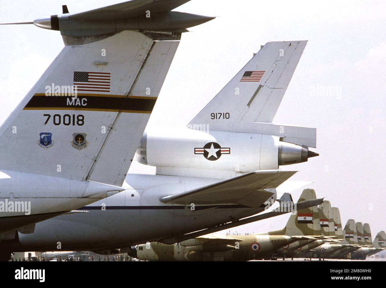 A left side view of the tail sections of a C-141 Starlifter, KC-10 ...