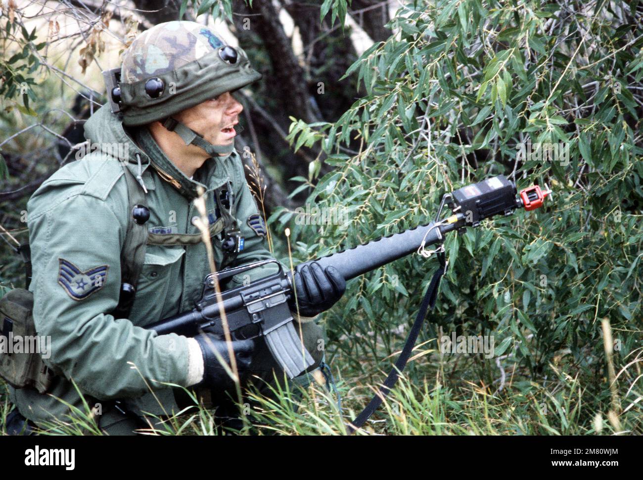 A staff sergeant carrying an M16 rifle participates in a security ...