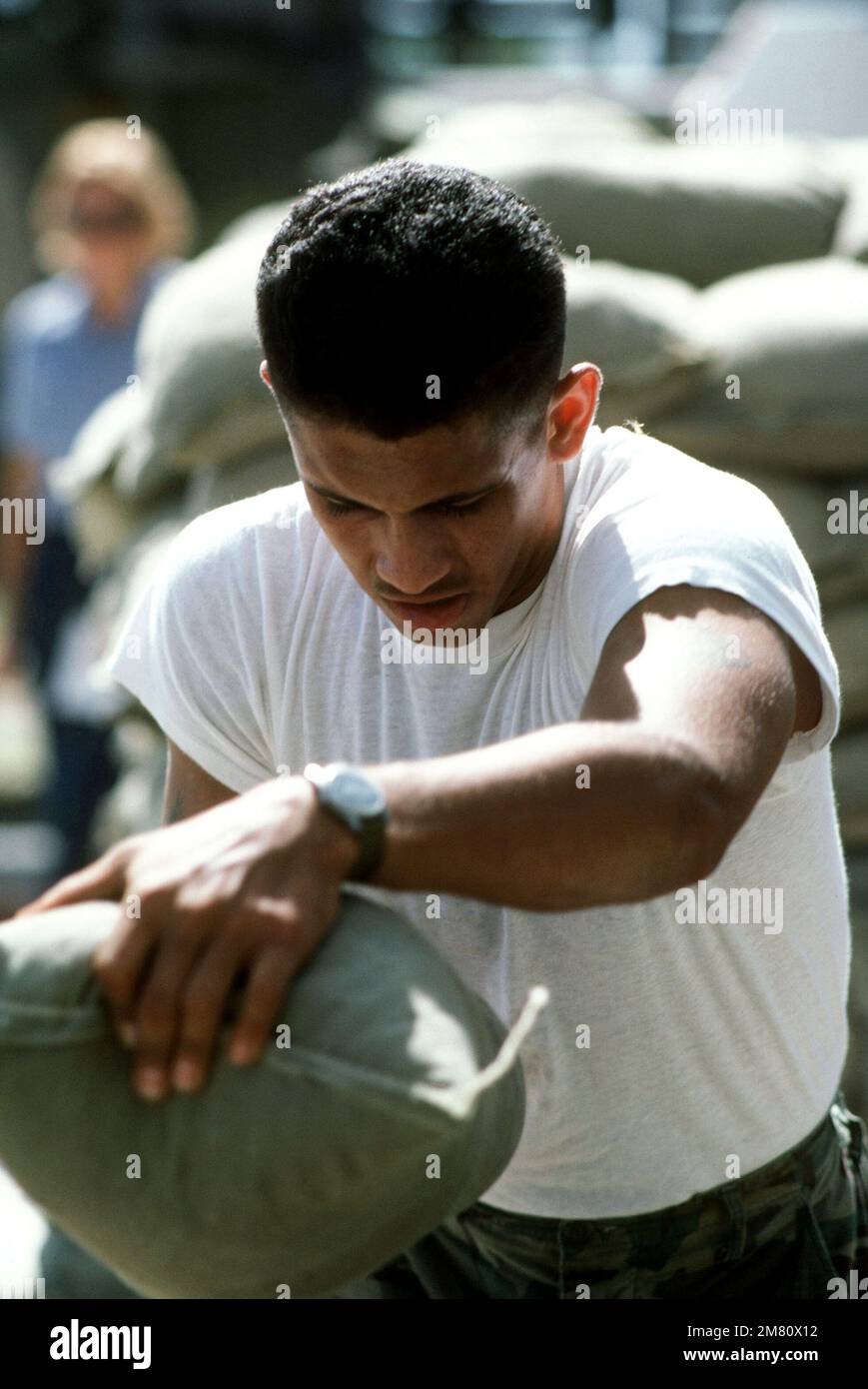 A member of the 400-man Marine Barracks Ground Defense Force stacks ...