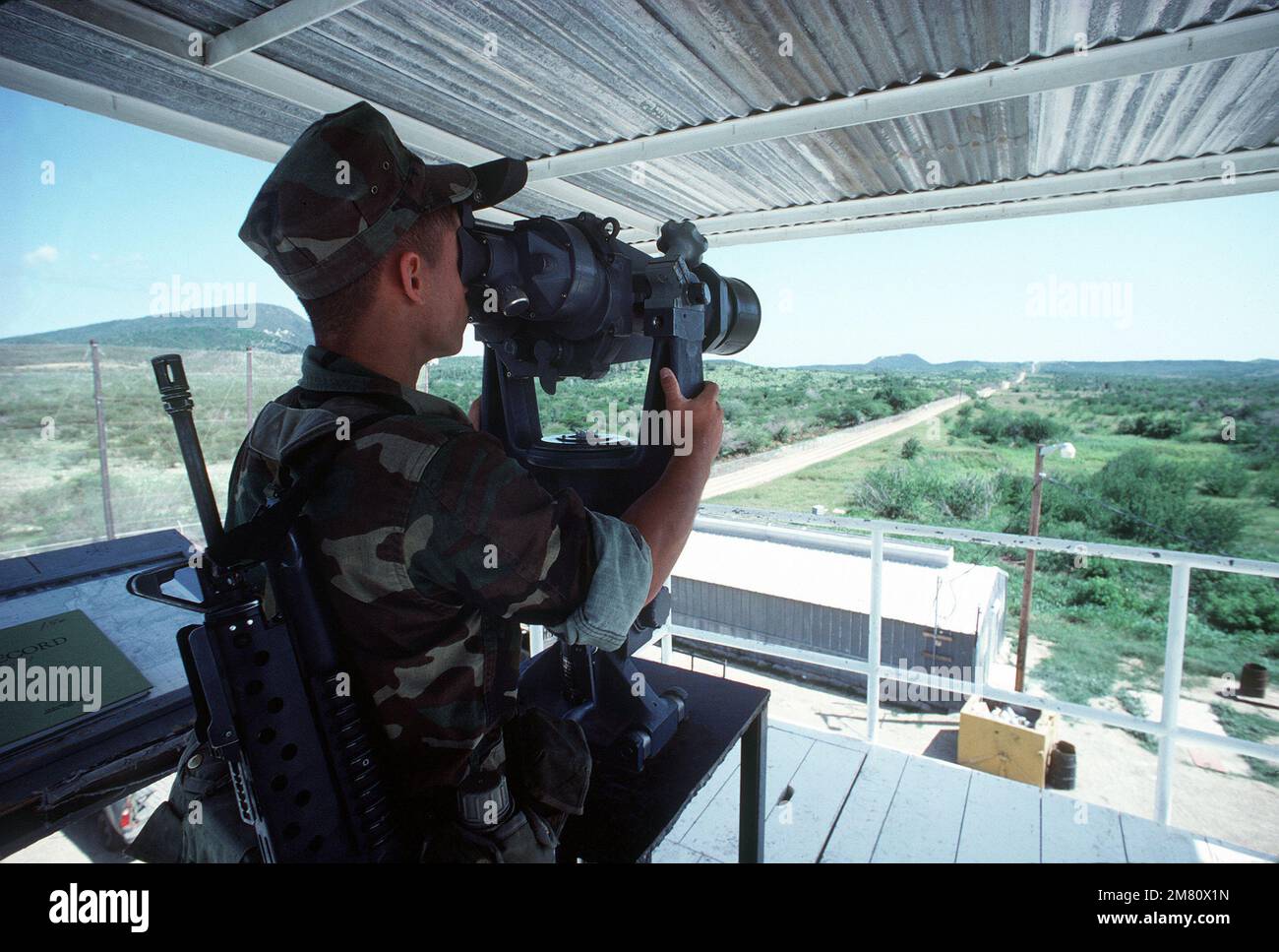 Lance CPL. Eddie Sanchez, a member of the Marine Barracks Ground Defense Force, watches over a ...