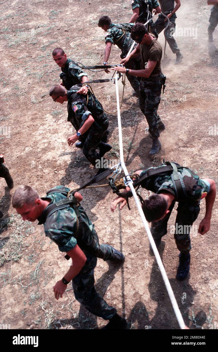 Members of the 24th Marine Amphibious Unit (MAU) prepare to be lifted ...
