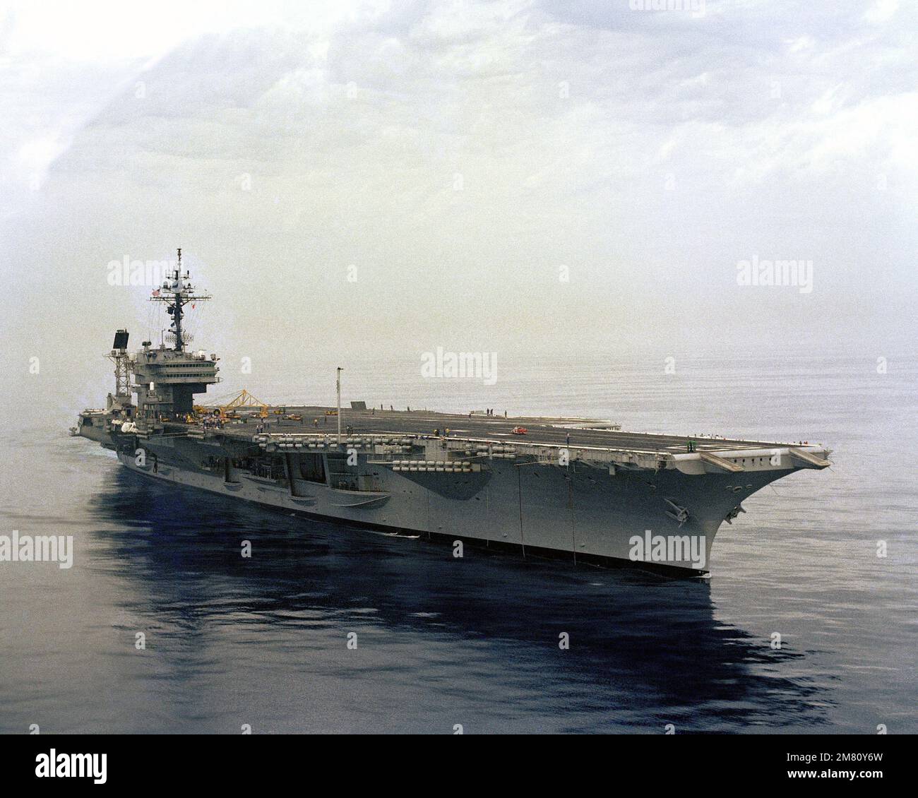 A starboard bow view of the aircraft carrier USS KITTY HAWK (CV 63 ...