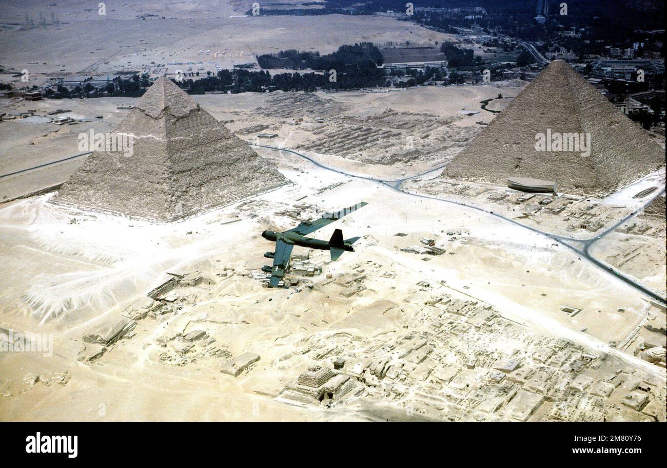 An air-to-air left rear view of a B-52 bomber aircraft as it flies over ...