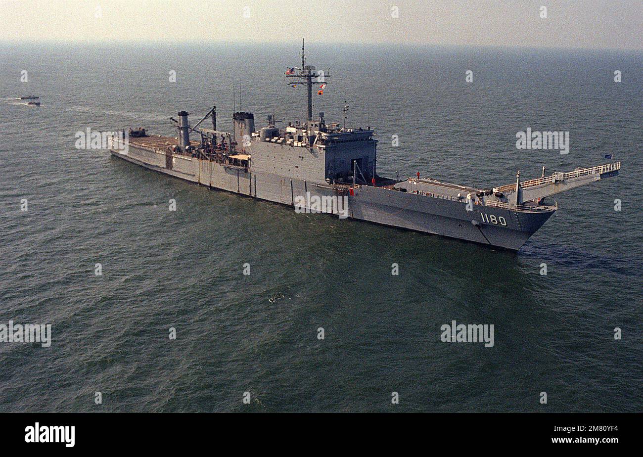 An aerial starboard bow view of the tank landing ship USS MANITOWOC ...