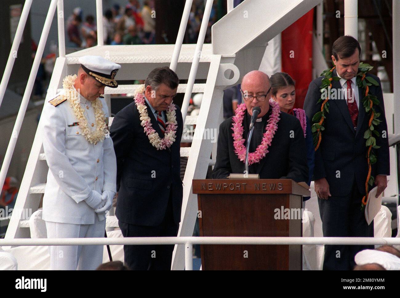 The Rev. Robert M. Burke gives the invocation at the launching ceremony ...