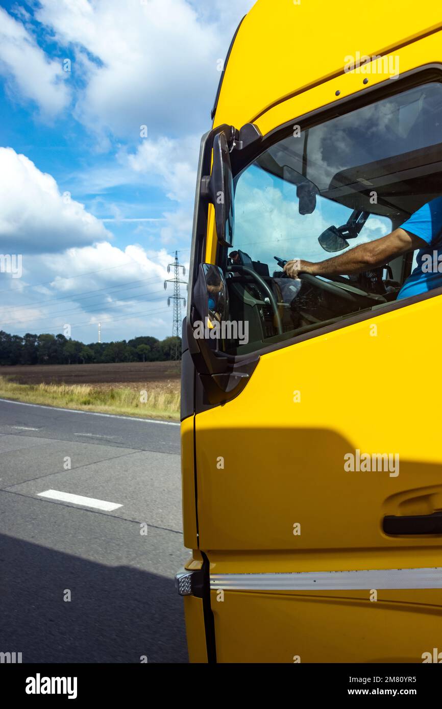 The cab of a truck driving on the highway Stock Photo - Alamy