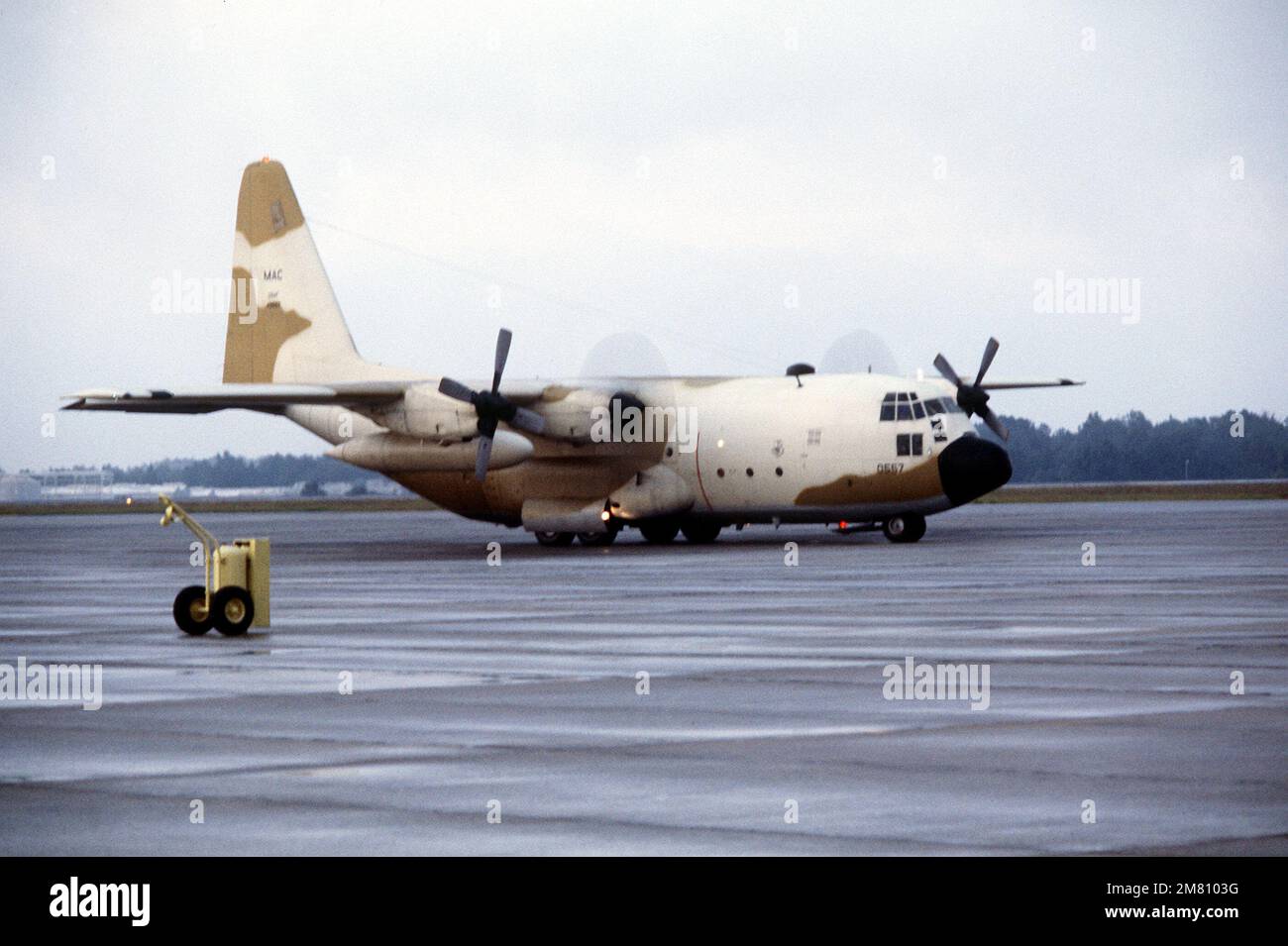 A C-130 Hercules aircraft prepares to takeoff on a support mission ...