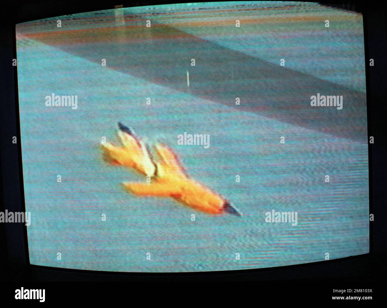 A BQM-34A target drone is hit by a laser beam fired by the Air Force ...