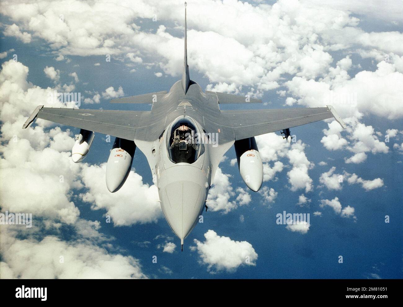 An air-to-air front view of an F-16 Fighting Falcon aircraft. Country ...