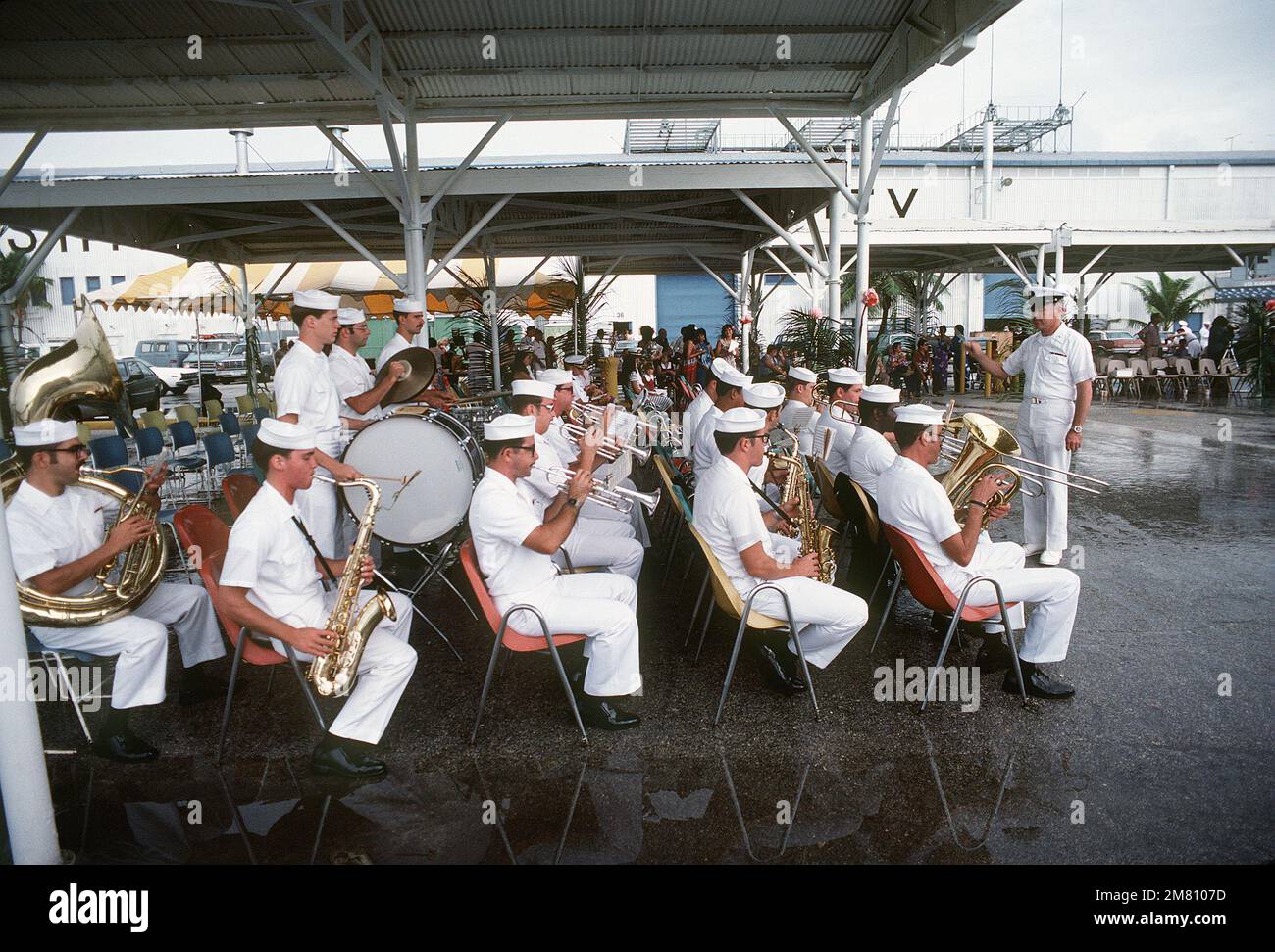 A Navy band plays at a welcoming ceremony for crew members of the ...