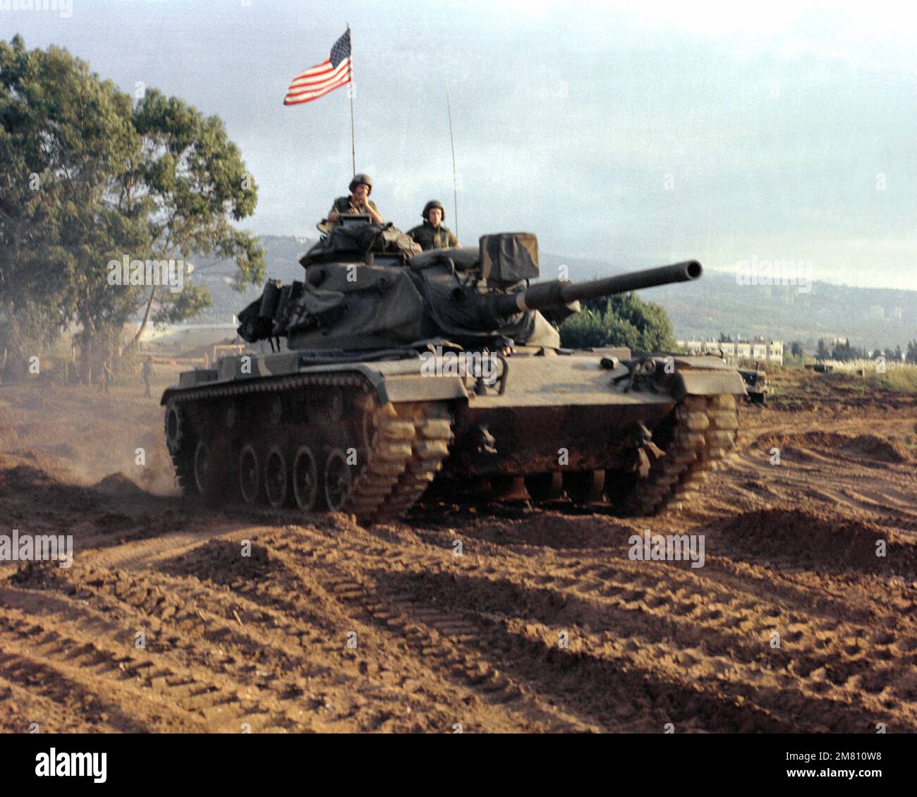 An M-60A1 main battle tank patrols the perimeter of the Marine compound ...