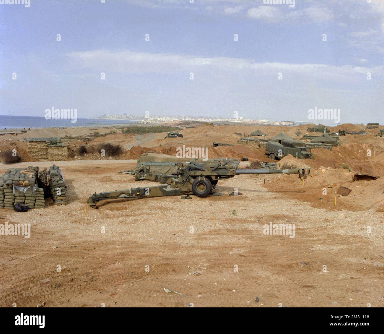 A right side view of 155mm M-1908 howitzer erected at a Marine position ...