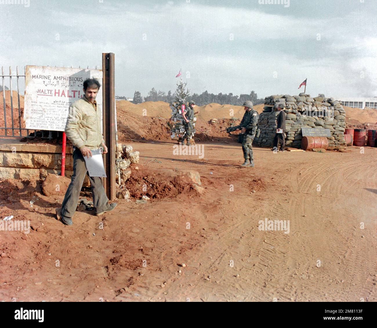 A Lebanese civilian approaches one of the entrances to the Marine ...