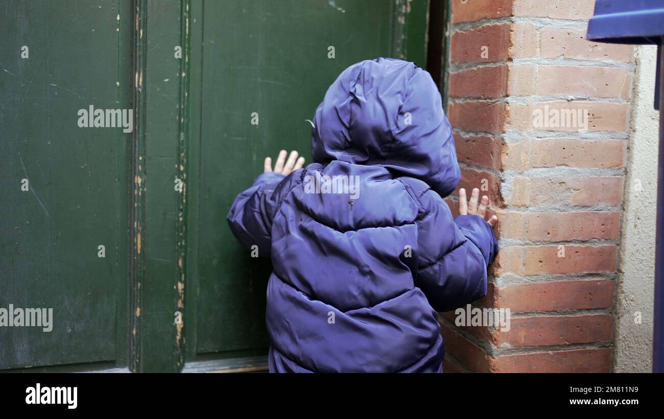 Boy pushing door open hi-res stock photography and images - Alamy