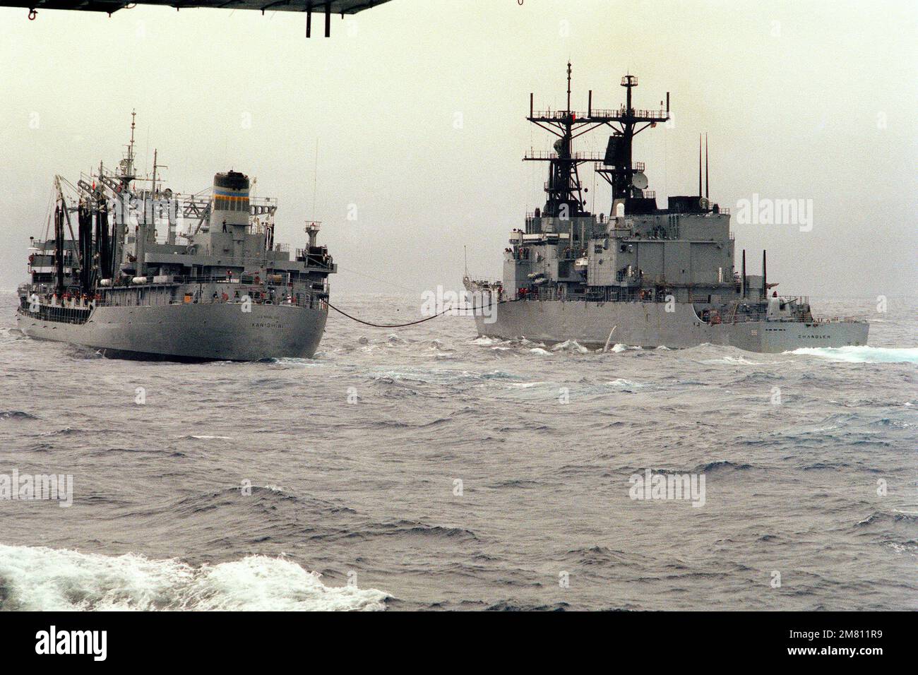 A port quarter view of the Kidd class guided missile destroyer USS ...