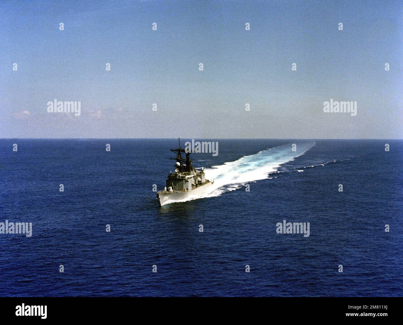 An aerial port bow view of the Kidd class guided missile destroyer USS ...