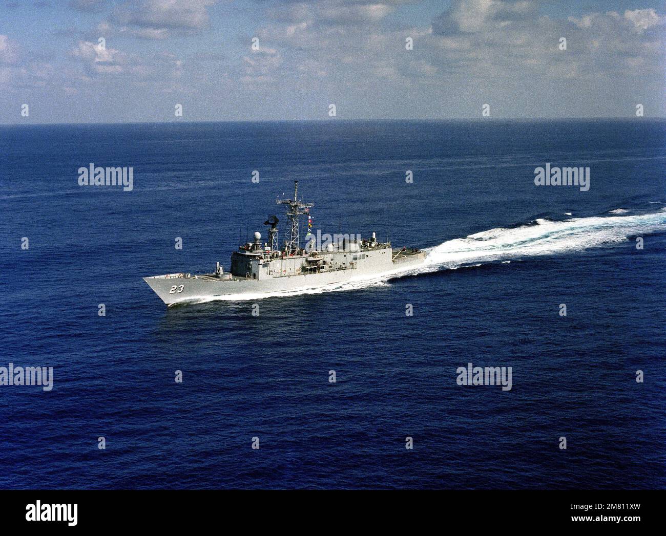 An aerial port bow view of the Oliver Hazard Perry class guided missile ...