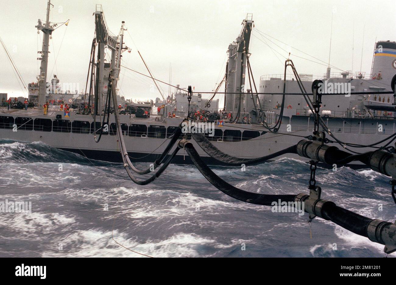 A view of fuel lines extended between the aircraft carrier USS KITTY ...