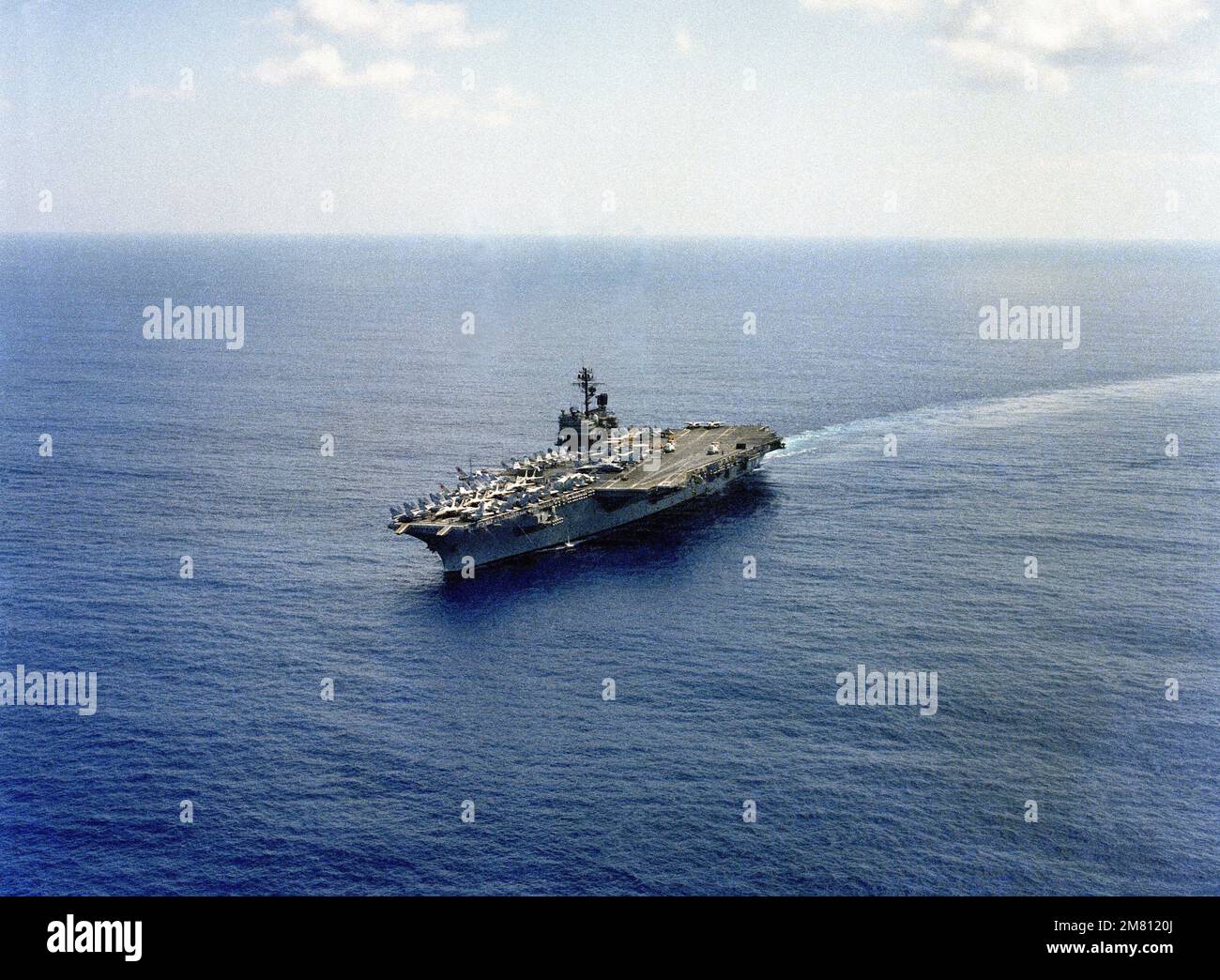 An aerial port bow view of the aircraft carrier USS KITTY HAWK (CV 63 ...