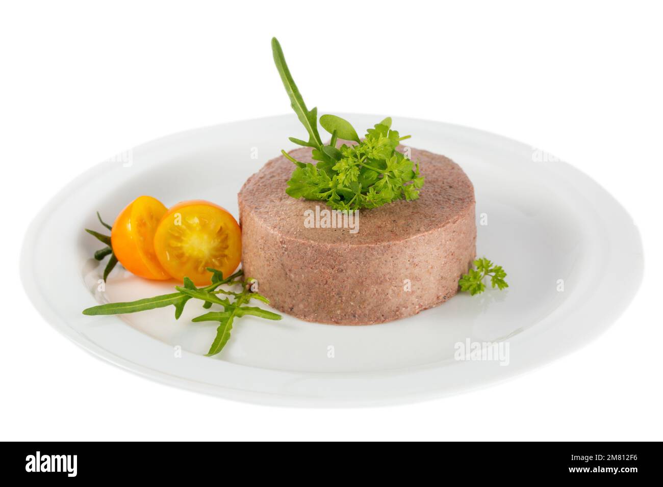 Savory meat pate served on a plate with vegetables, isolated on a white ...