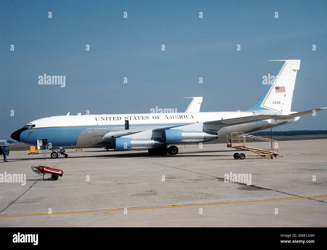 A left side view of a C-135 aircraft parked on the flight line. Base ...