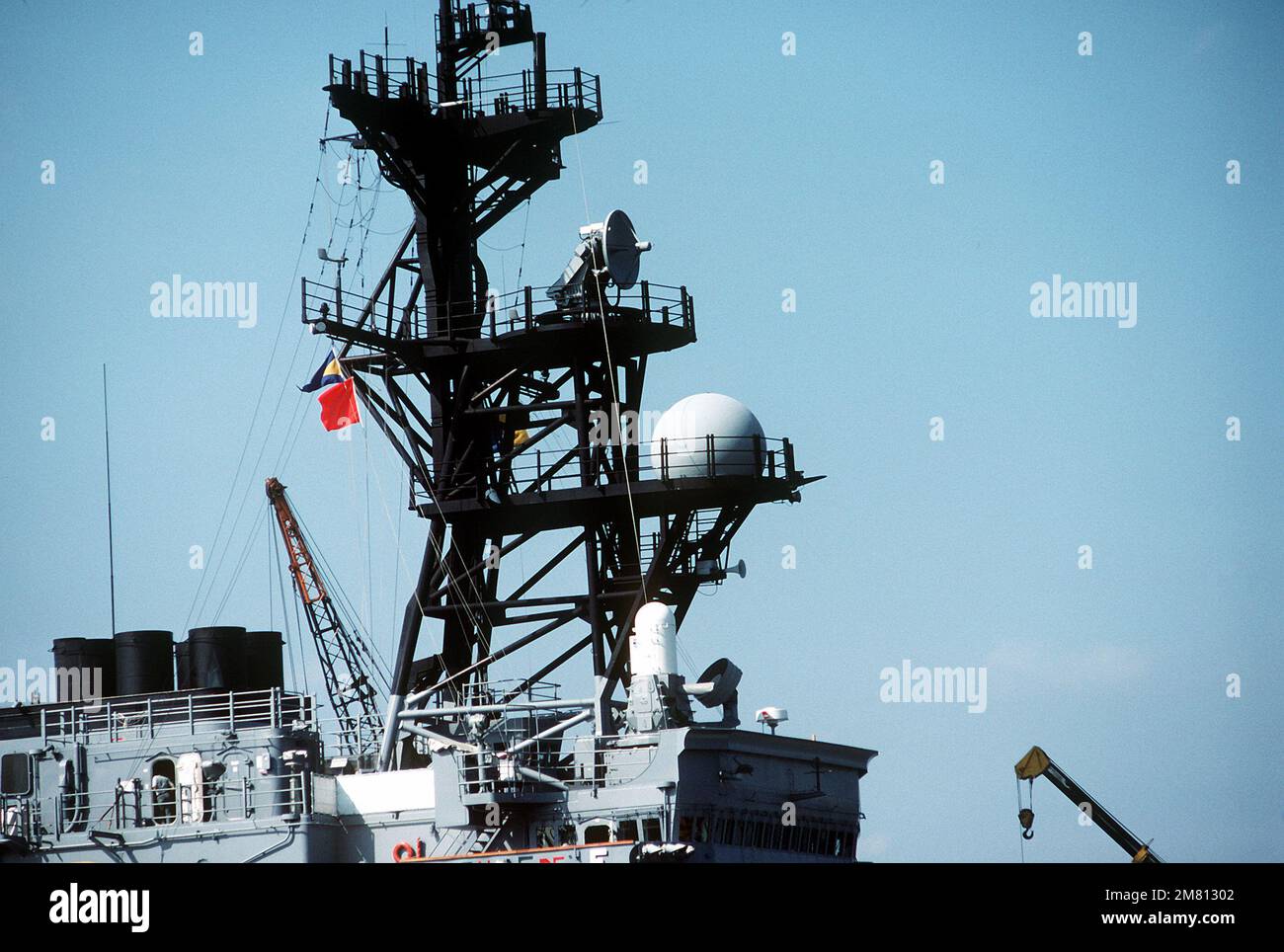 A view of the foremast of the destroyer USS CARON (DD-970). Above the ...