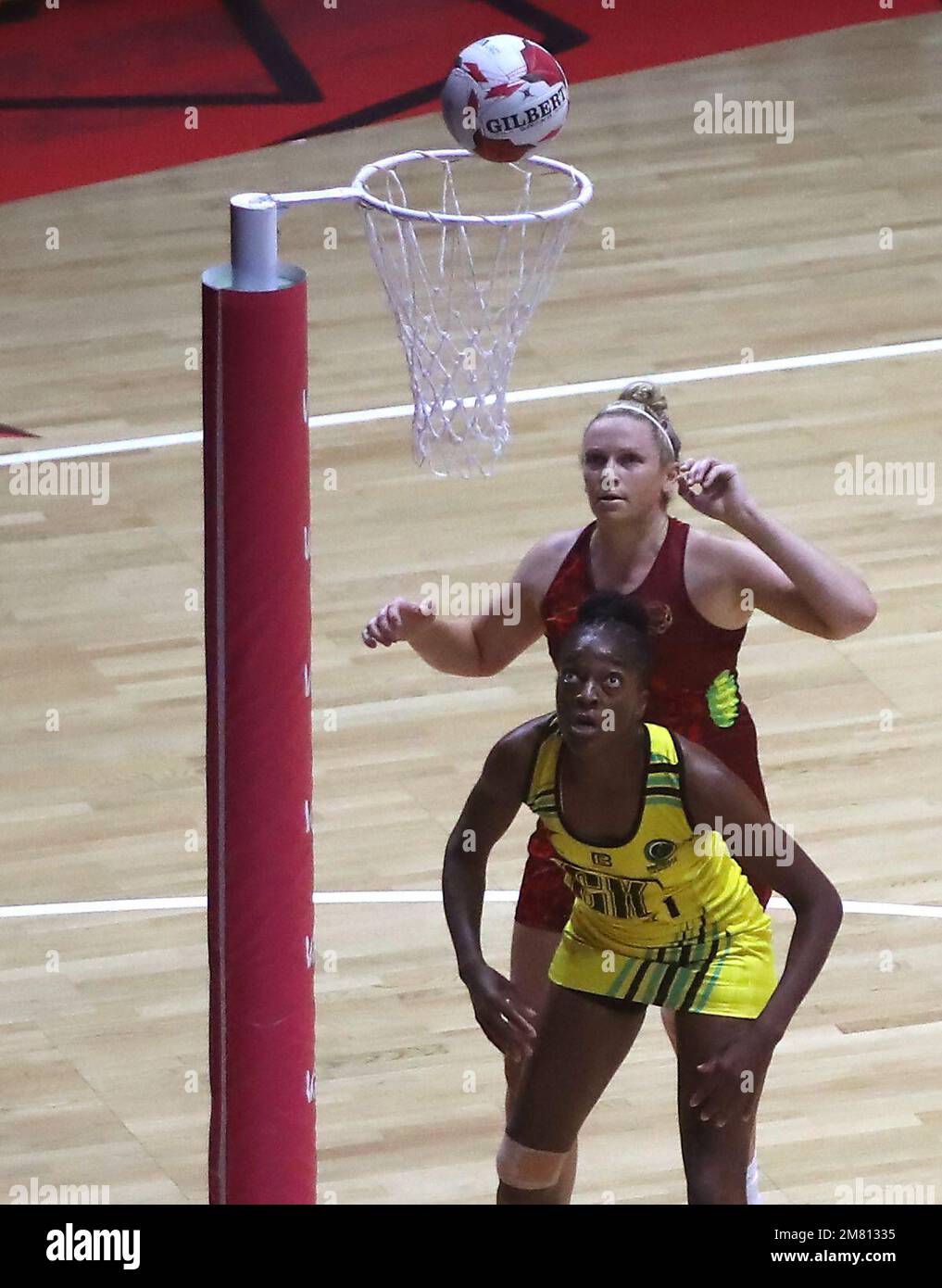 England's Joanne Harten (top) scores a goal during the Vitality Netball ...