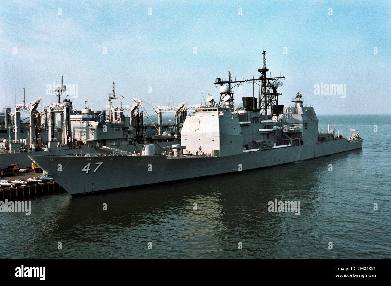 A port bow view of the Ticonderoga class Aegis guided missile cruiser ...