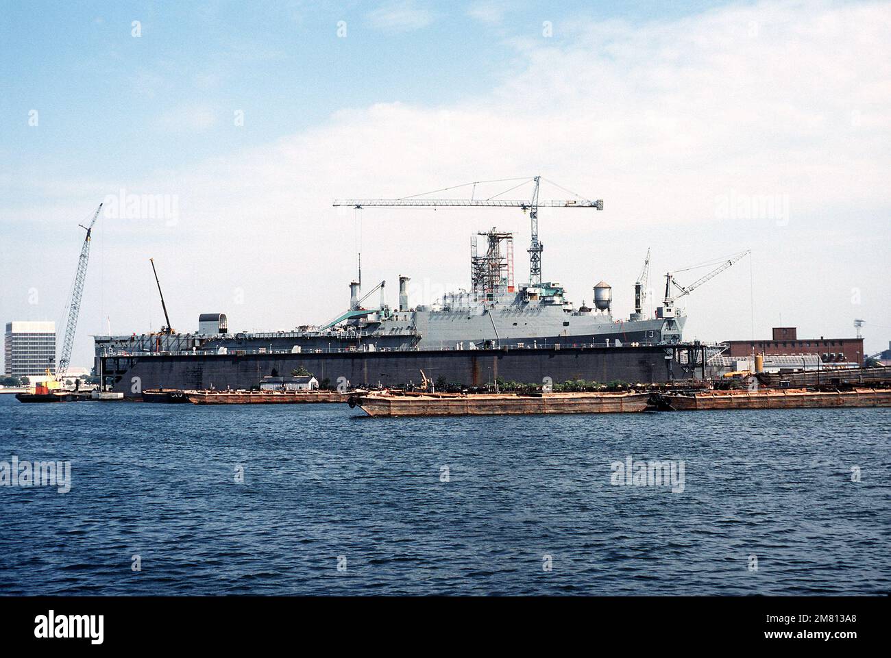 A starboard beam view of the amphibious transport dock USS NASHVILLE ...