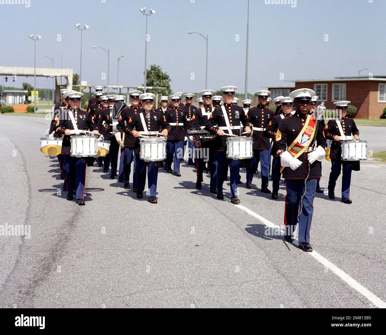 The Drum and Bugle Corps of the Marine Corps Logistics Base marches ...