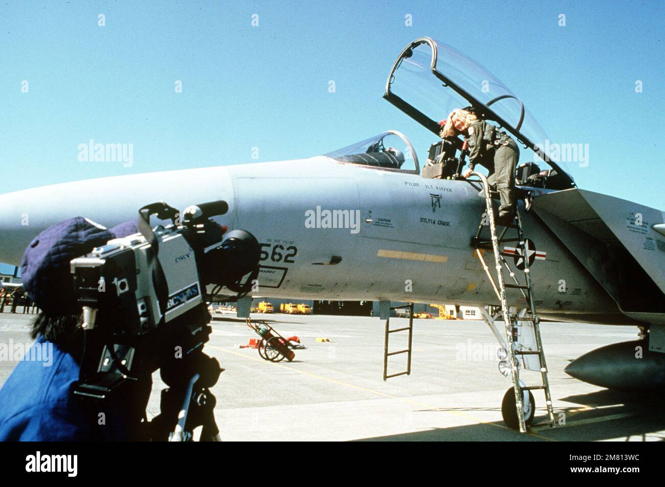 ABC News cameraman films news reporter Sylvia Chase as she climbs into ...
