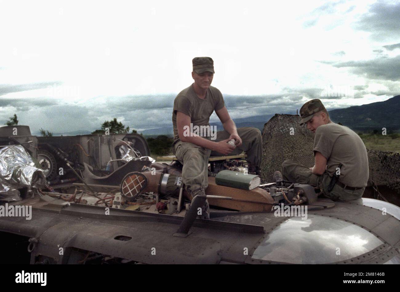 Members of Company A, 101st Aviation Battalion, perform maintenance on ...
