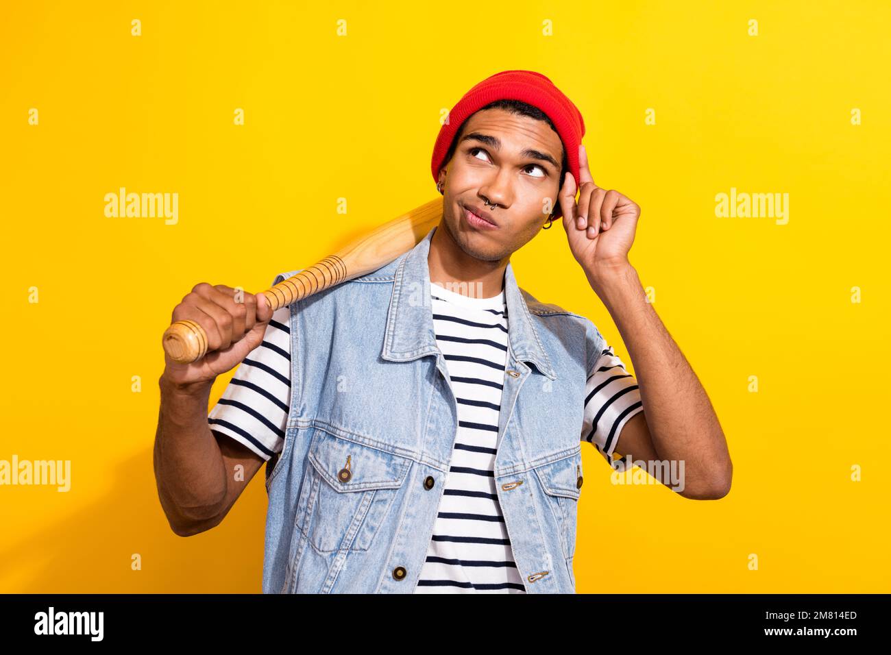 Photo of minded handsome guy arm touch headwear hold baseball bat look ...