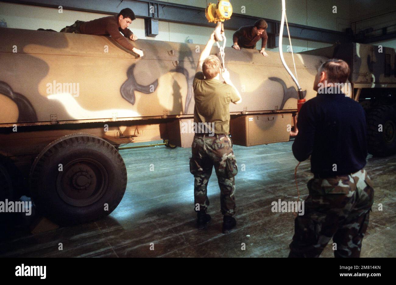 Members of the 501st Tactical Missile Maintenance Squadron prepare to ...