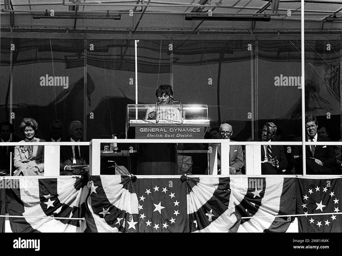 Joan Clark, wife of National Security Advisor William P. Clark, reads a ...